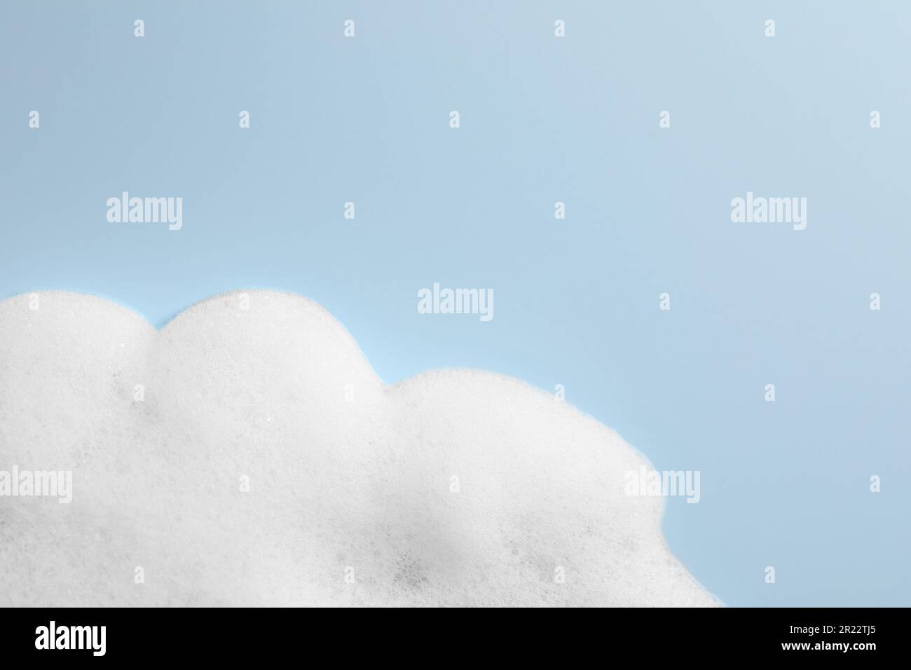 Foam sample on light blue background, top view. Space for text Stock ...