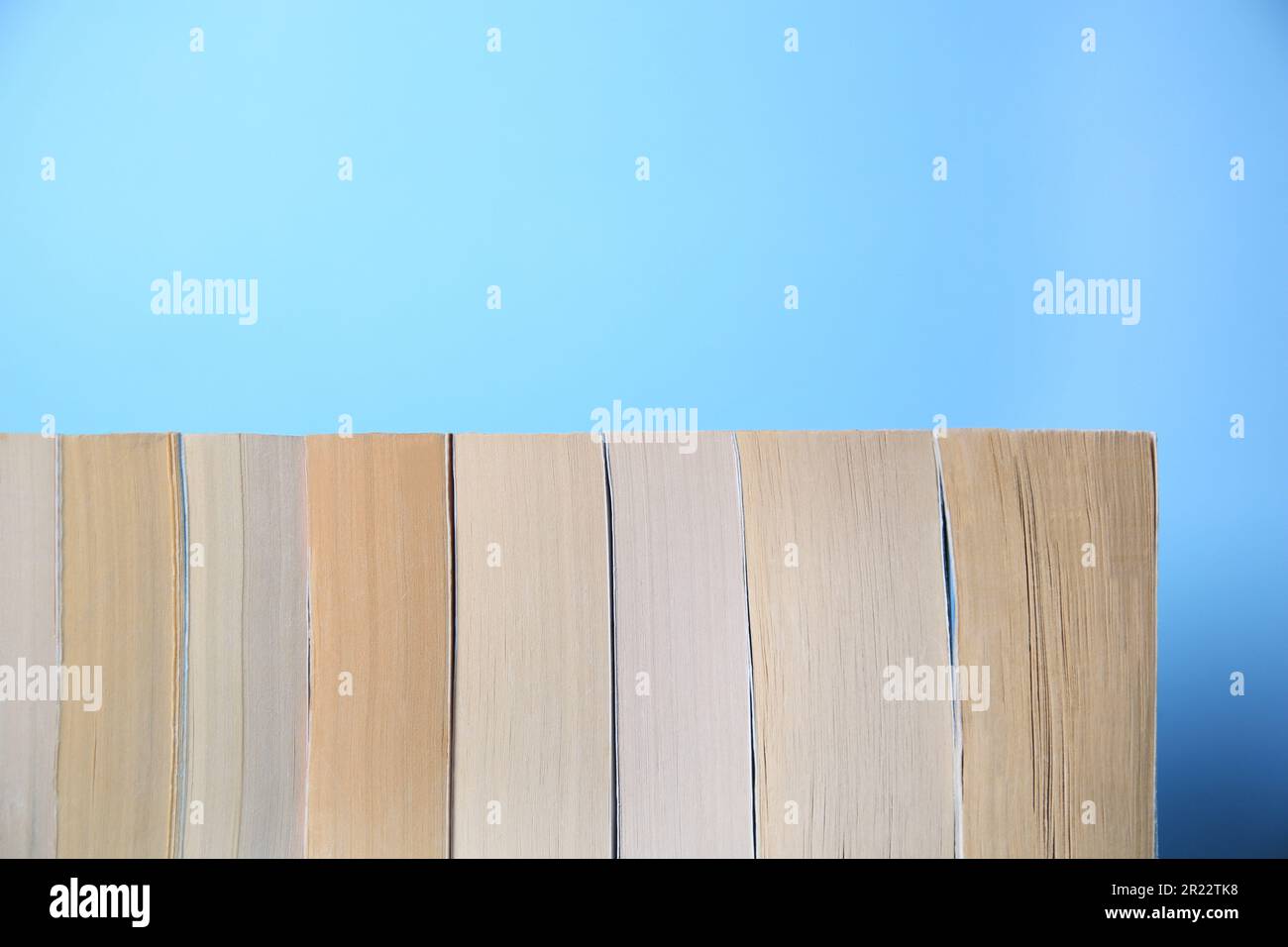 Collection of books on light blue background, space for text Stock ...