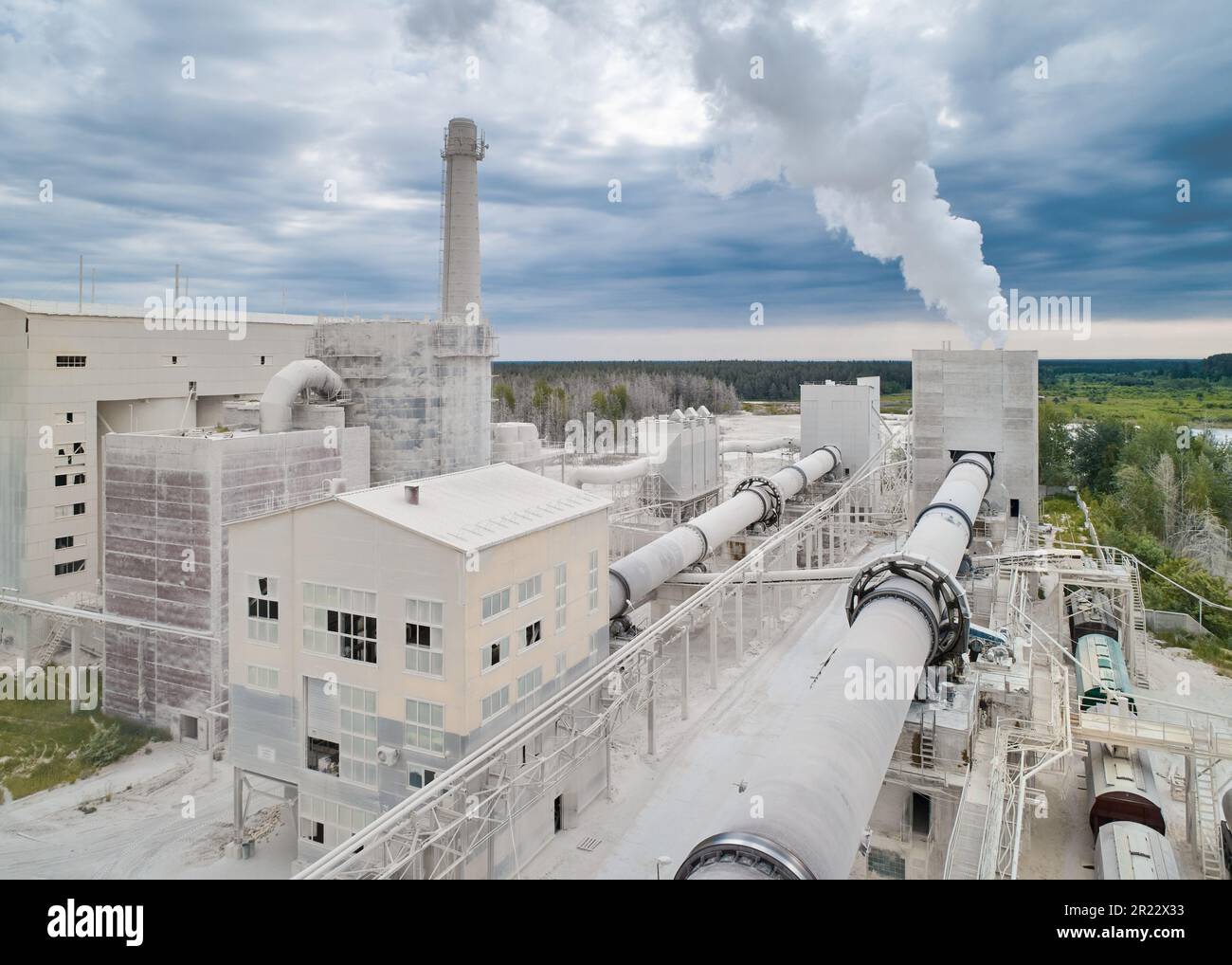 Calx roasting rotating furnace with pipe and steam at plant Stock Photo ...