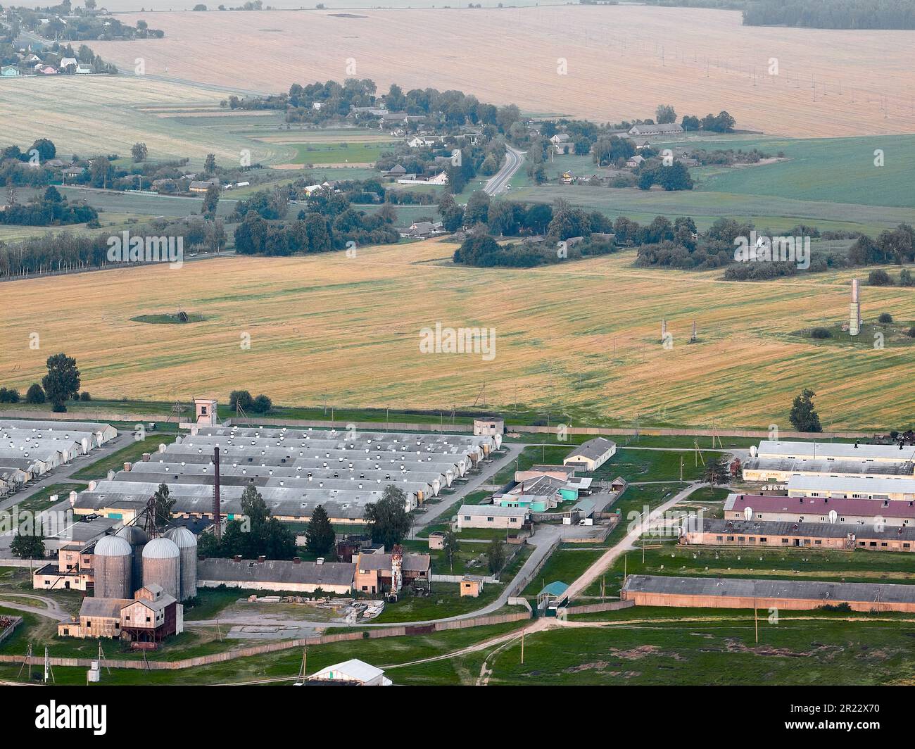 Industrial pig farm surrounded by huge plantation and fields Stock ...