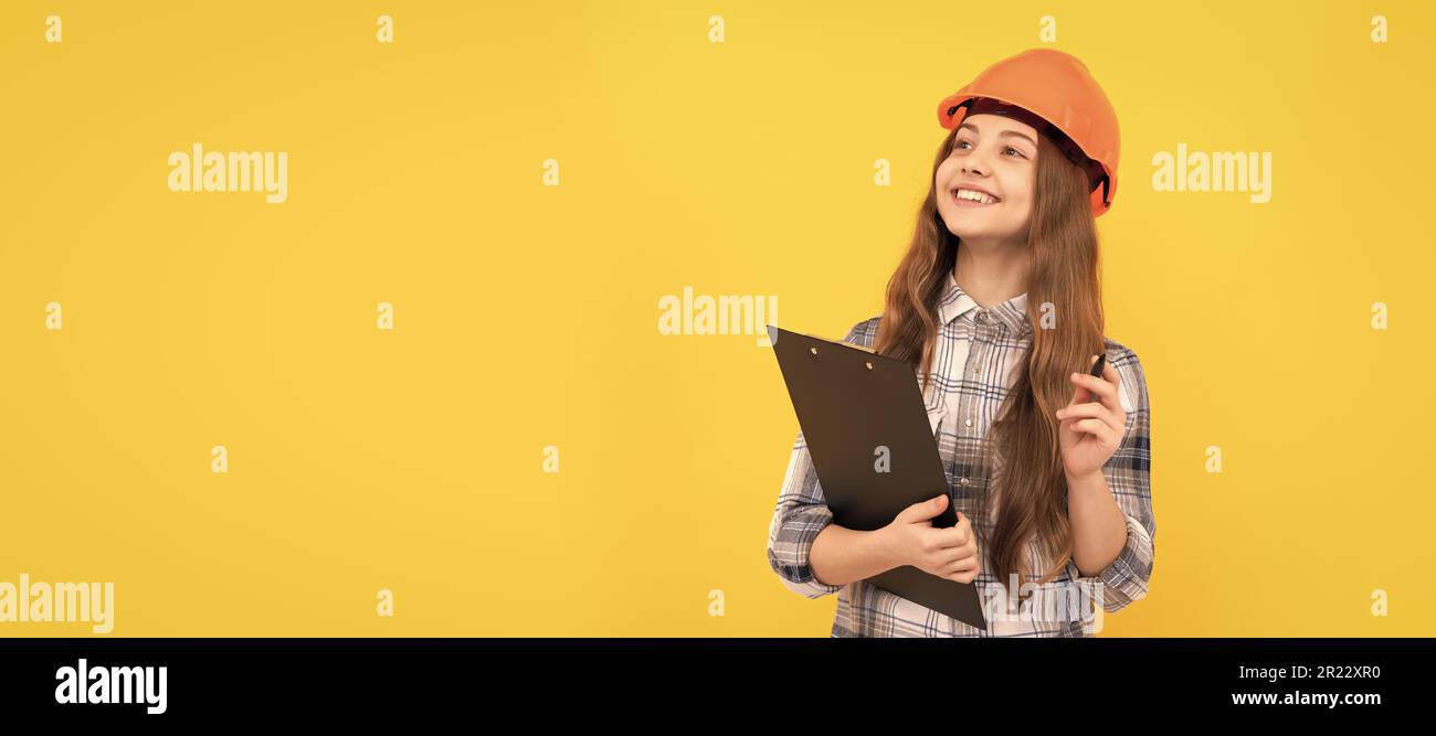 Builder teenager girl in helmet. happy teen girl in helmet and ...