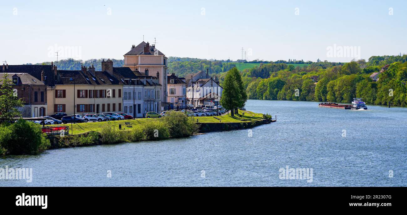 Colorful houses on the banks of the Yonne river in the town of ...