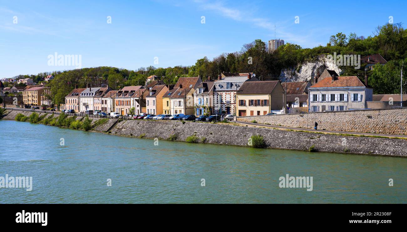 Colorful houses on the banks of the Yonne river in the town of ...
