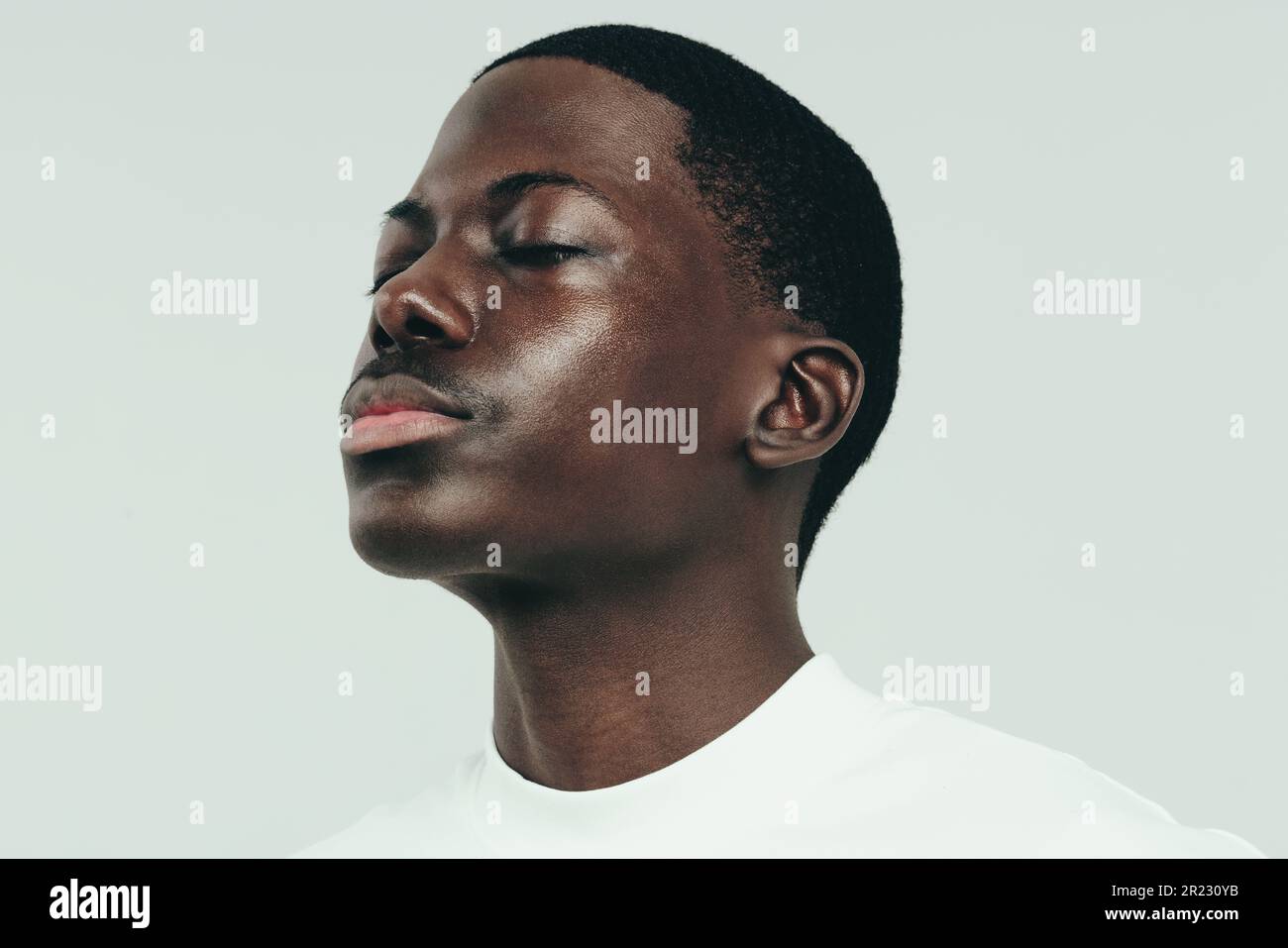 Young black man showing hi-res stock photography and images - Alamy