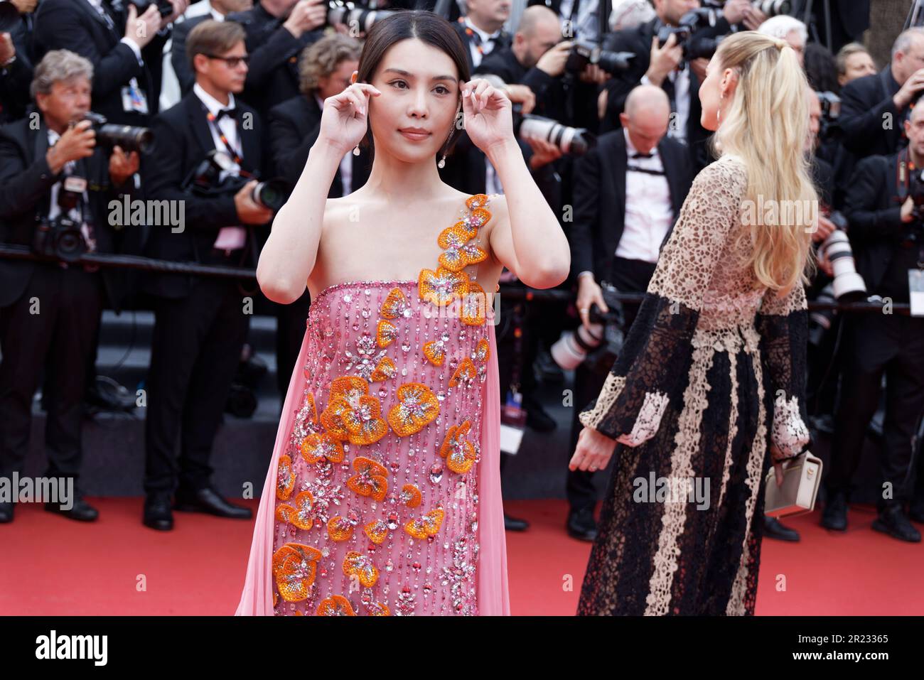 Cannes, France. 16th May, 2023. Dan Tong Han walks the first red carpet ...
