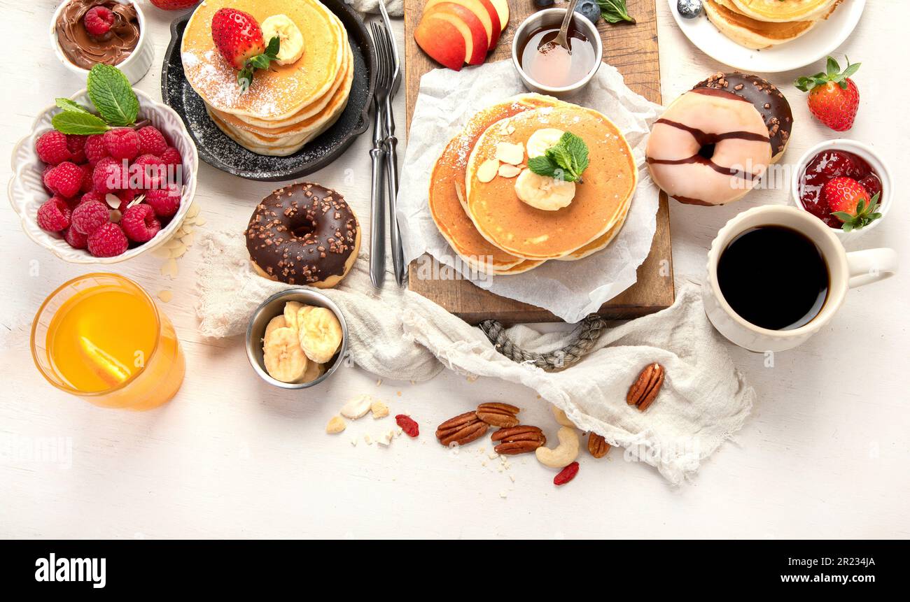 Continental breakfast. Coffee, jam, pancakes, maffins. White background ...