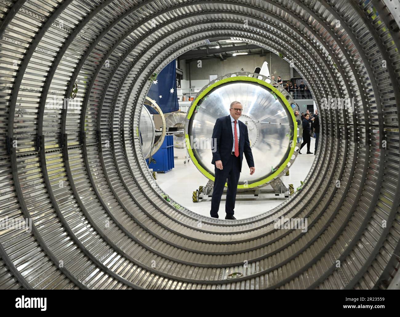 Prime Minister Anthony Albanese is seen looking at the engine casing ...