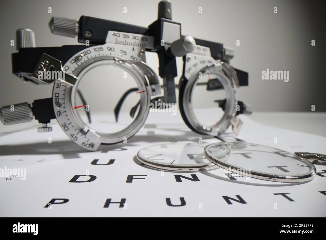 Optometric glasses lie on Snellen chart paper with letters Stock Photo ...