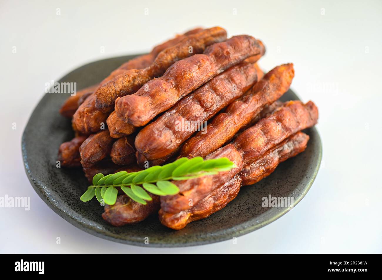 Tamarind sweet for food fruit ripe tamarinds on plate and white ...
