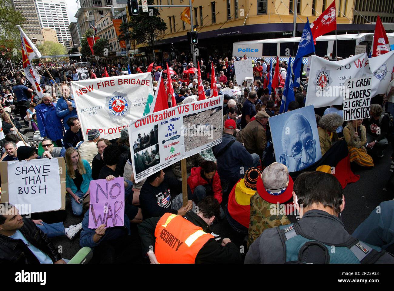 Anti-APEC and anti-Bush protesters conduct a rally at the intersection ...