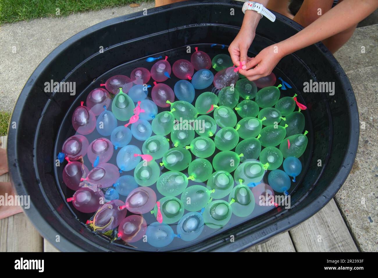 Water balloons ready for kids on a hot day Stock Photo - Alamy
