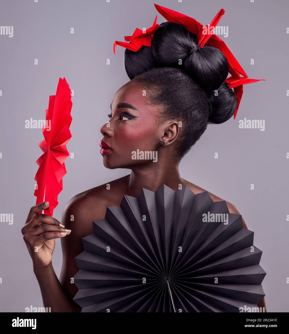 Culture, makeup and creative with black woman in studio for origami ...