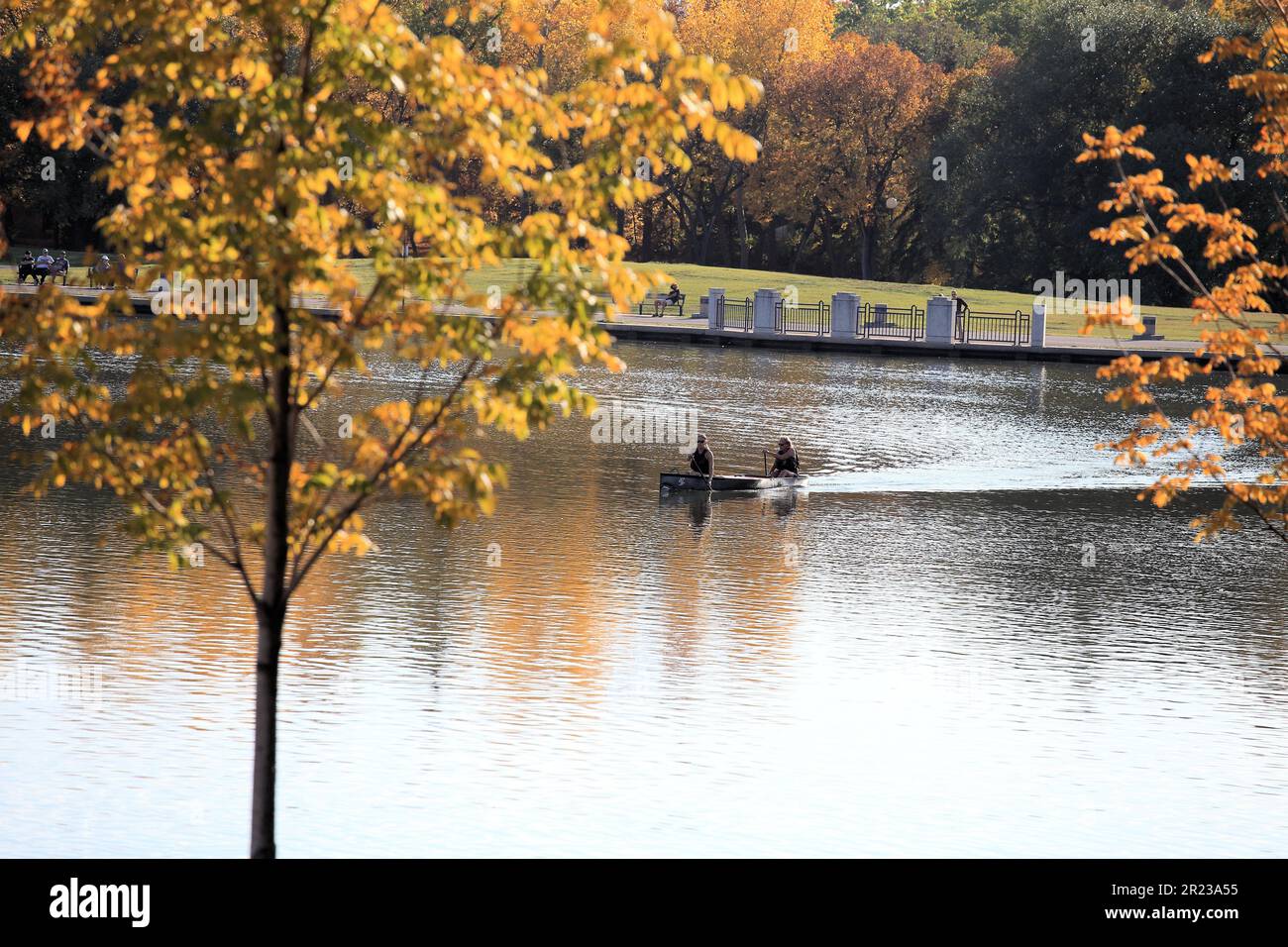 Canoeists paddling Wascana Lake in Regina, Saskatchewan in early fall ...