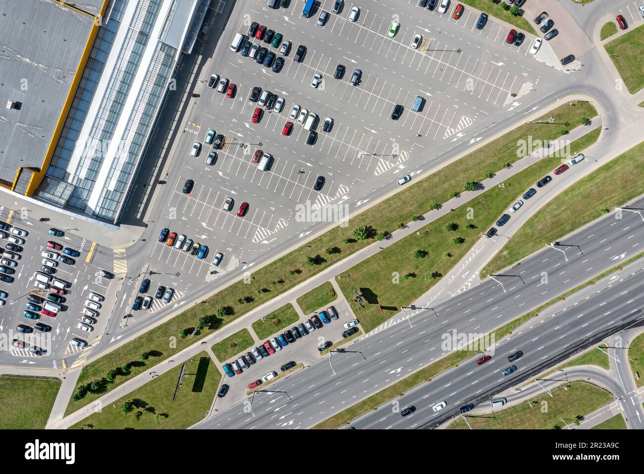shopping mall parking lot with many parked cars. top view aerial photo ...