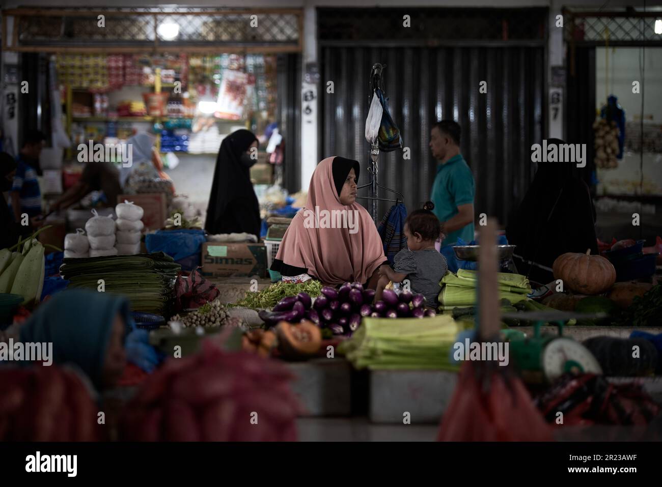 Muslim Woman selling vegetables at Central Traditional Market ...