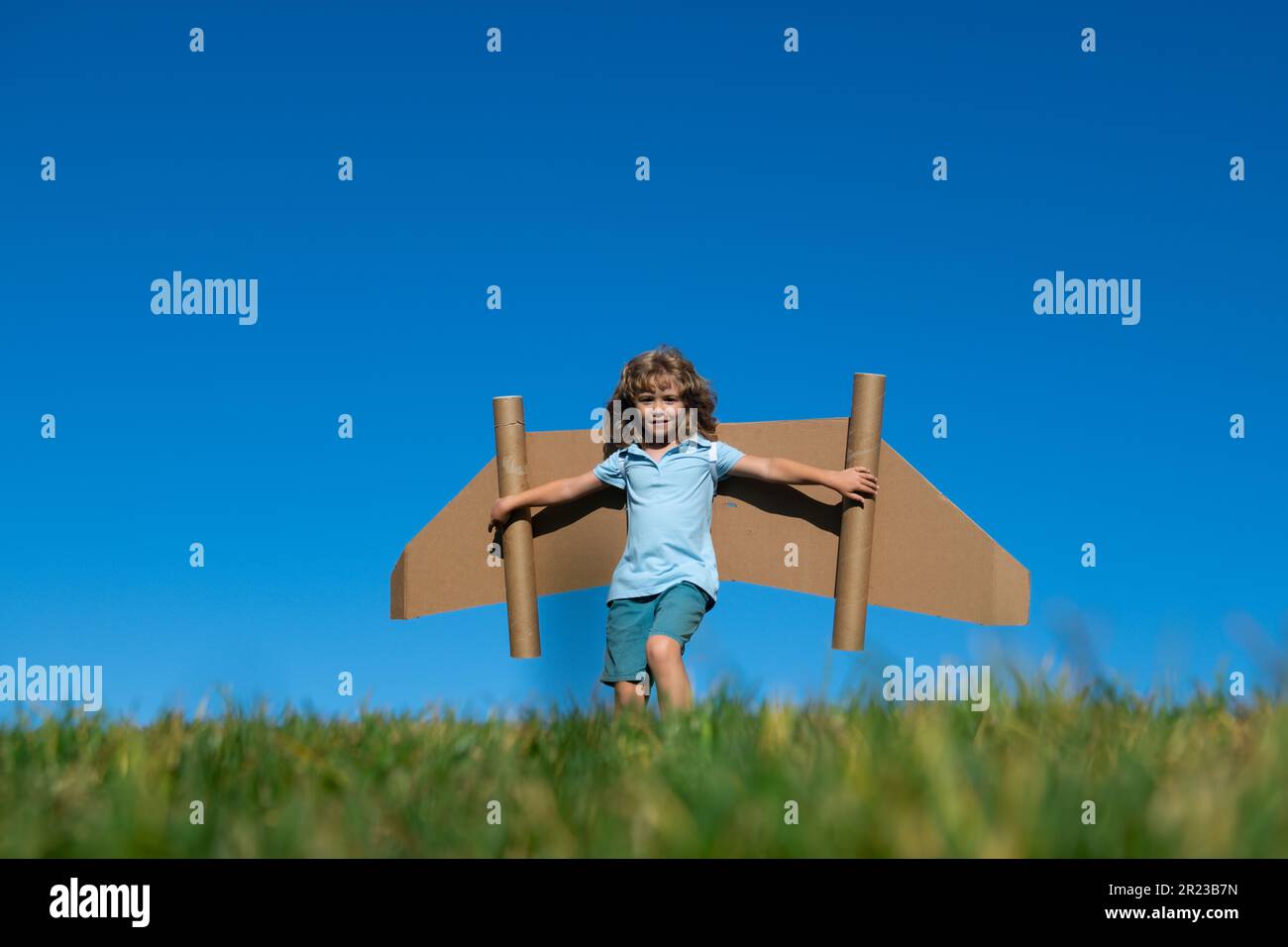 Boy child with wings at sky imagines a pilot and dreams of flying Stock ...