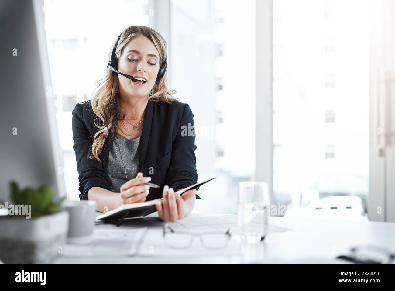 Secretary, receptionist and woman writing notes in the office planning ...