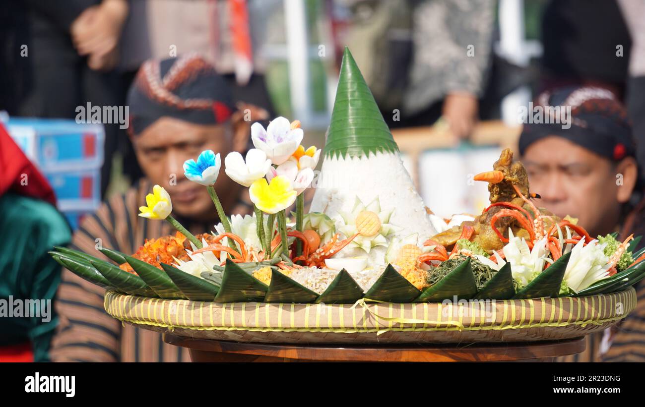 Nasi tumpeng (cone rice) served with urap-urap (Indonesian salad ...