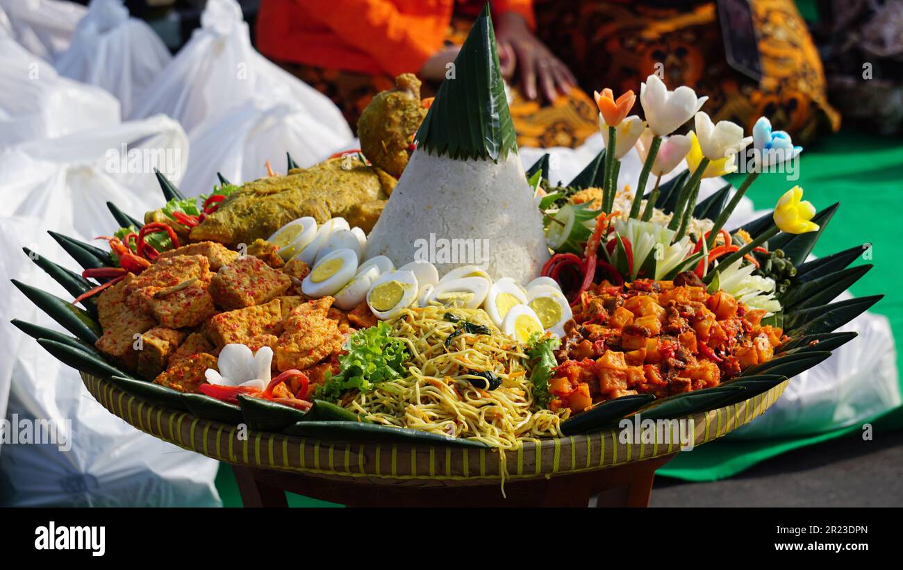 Nasi tumpeng (cone rice) served with urap-urap (Indonesian salad ...