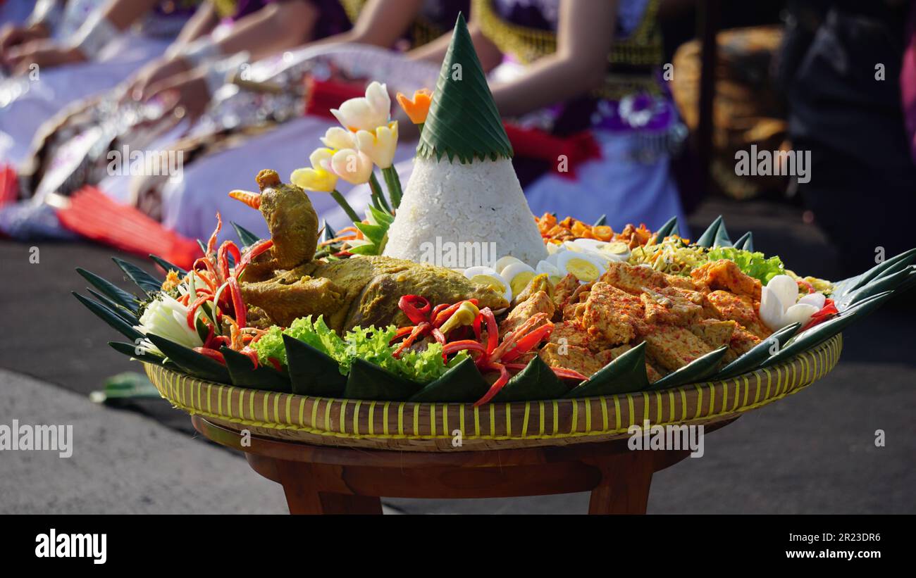 Nasi tumpeng (cone rice) served with urap-urap (Indonesian salad ...