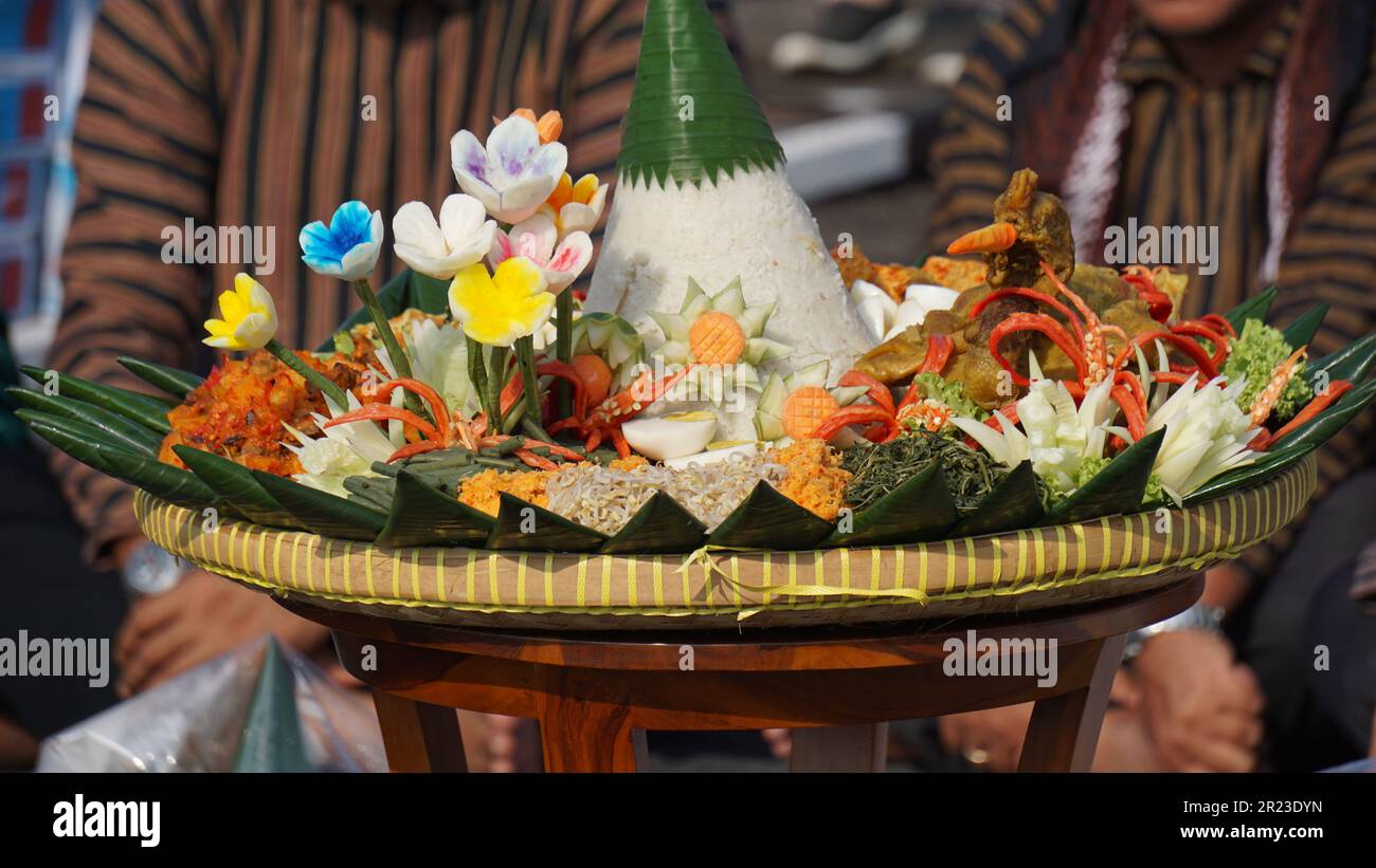 Nasi tumpeng (cone rice) served with urap-urap (Indonesian salad ...