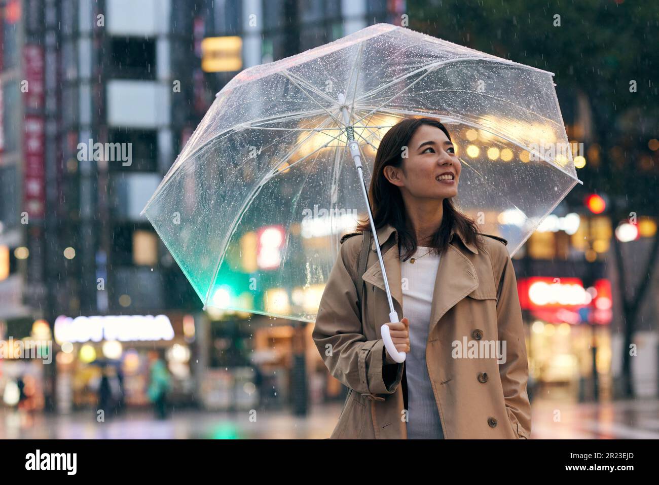 Japanese woman in the rain Stock Photo - Alamy