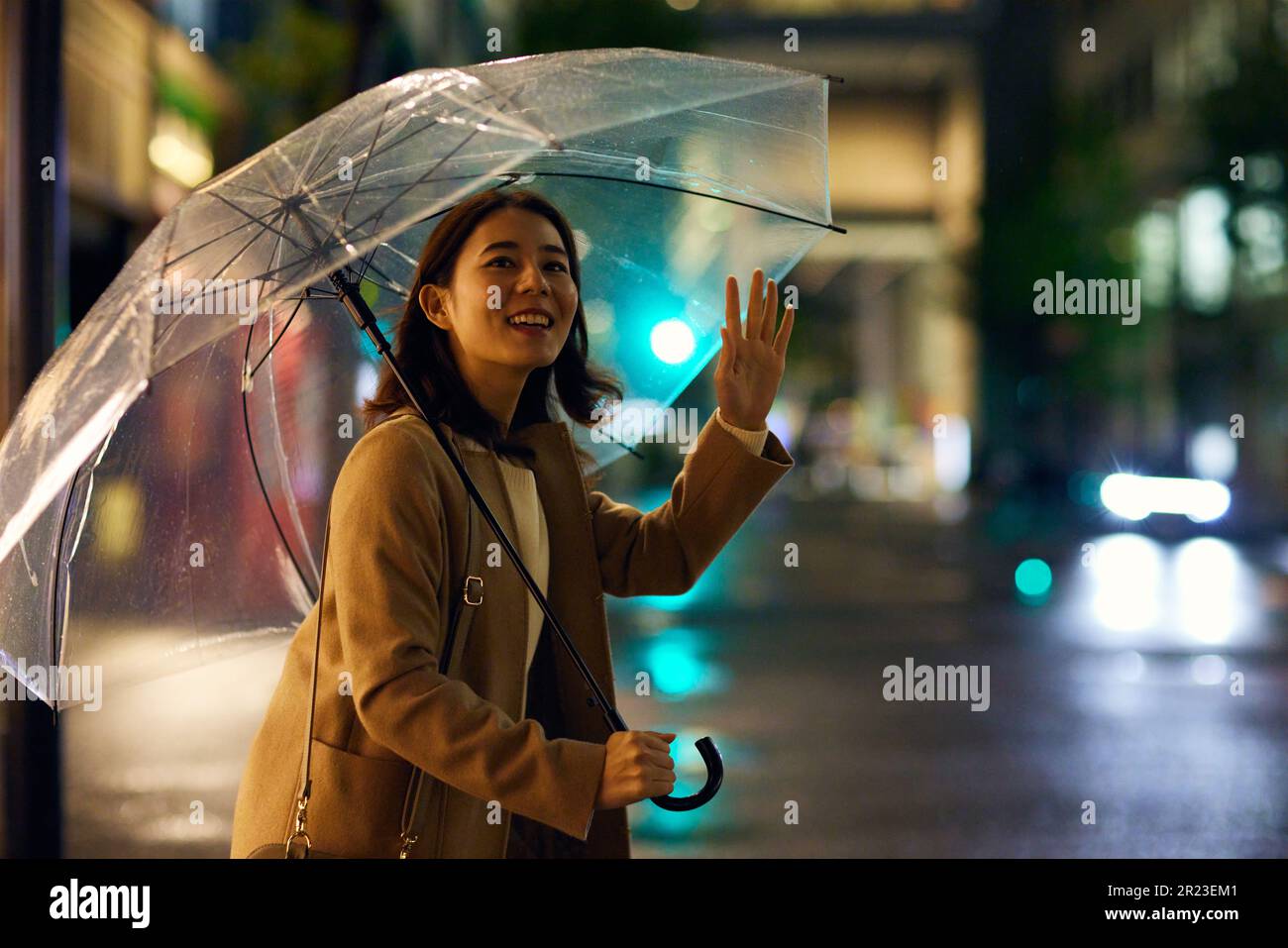 Japanese woman in the rain Stock Photo - Alamy