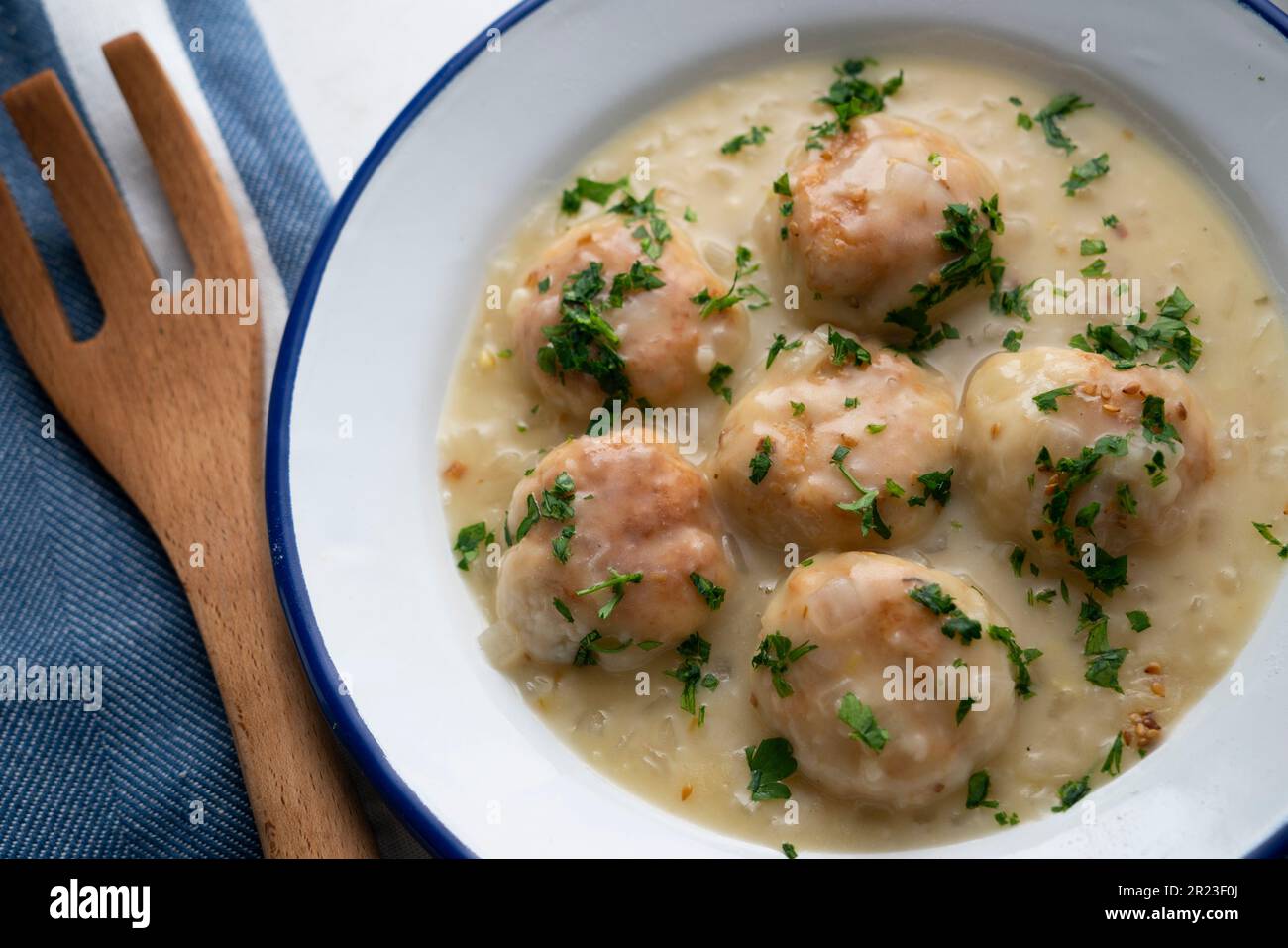 Fish meatballs with white wine sauce Stock Photo - Alamy