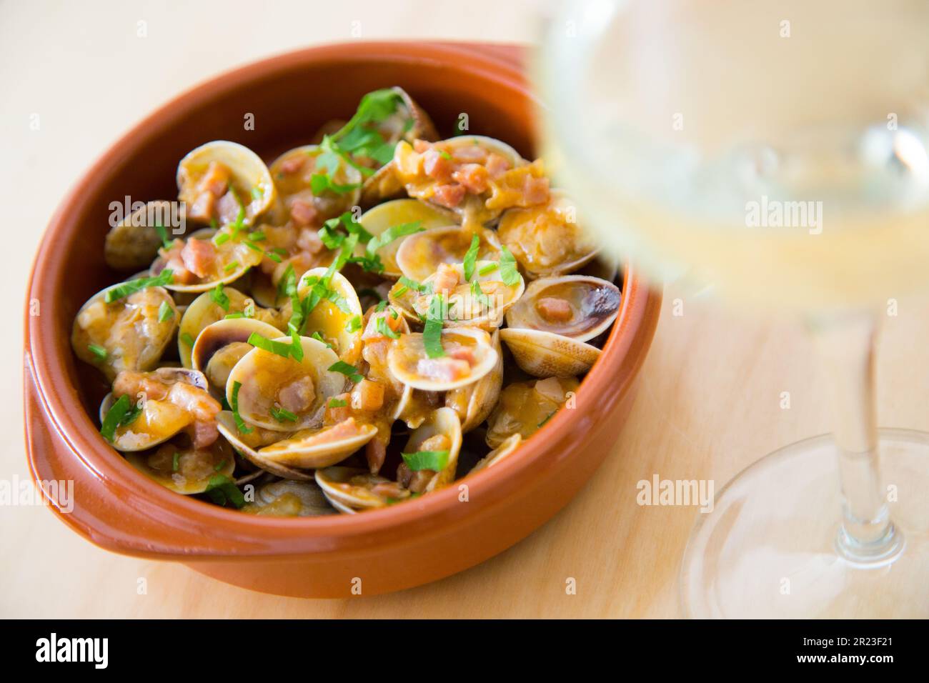 Spanish tapa of clams cooked in white wine. Traditional Spanish recipe ...