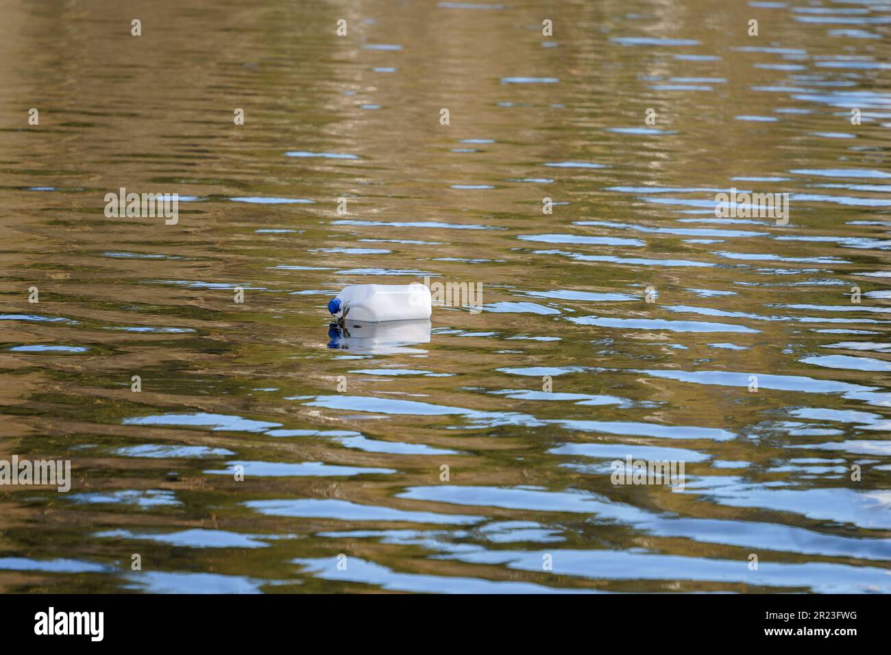White plastic canister marking the fish trap floating on water Stock ...