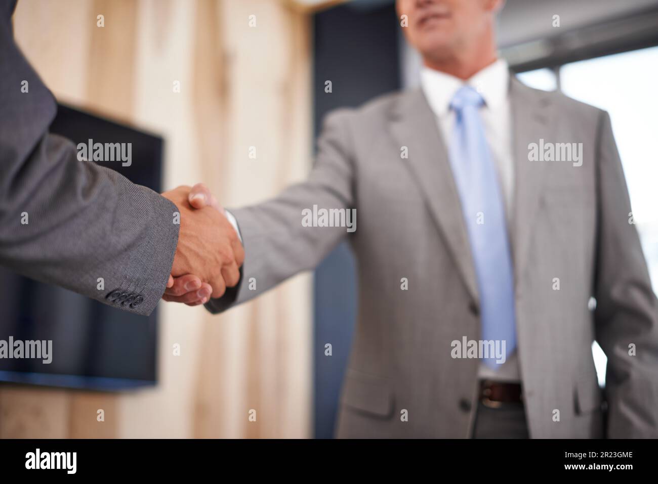 The deal is done. two businessmen shaking hands Stock Photo - Alamy