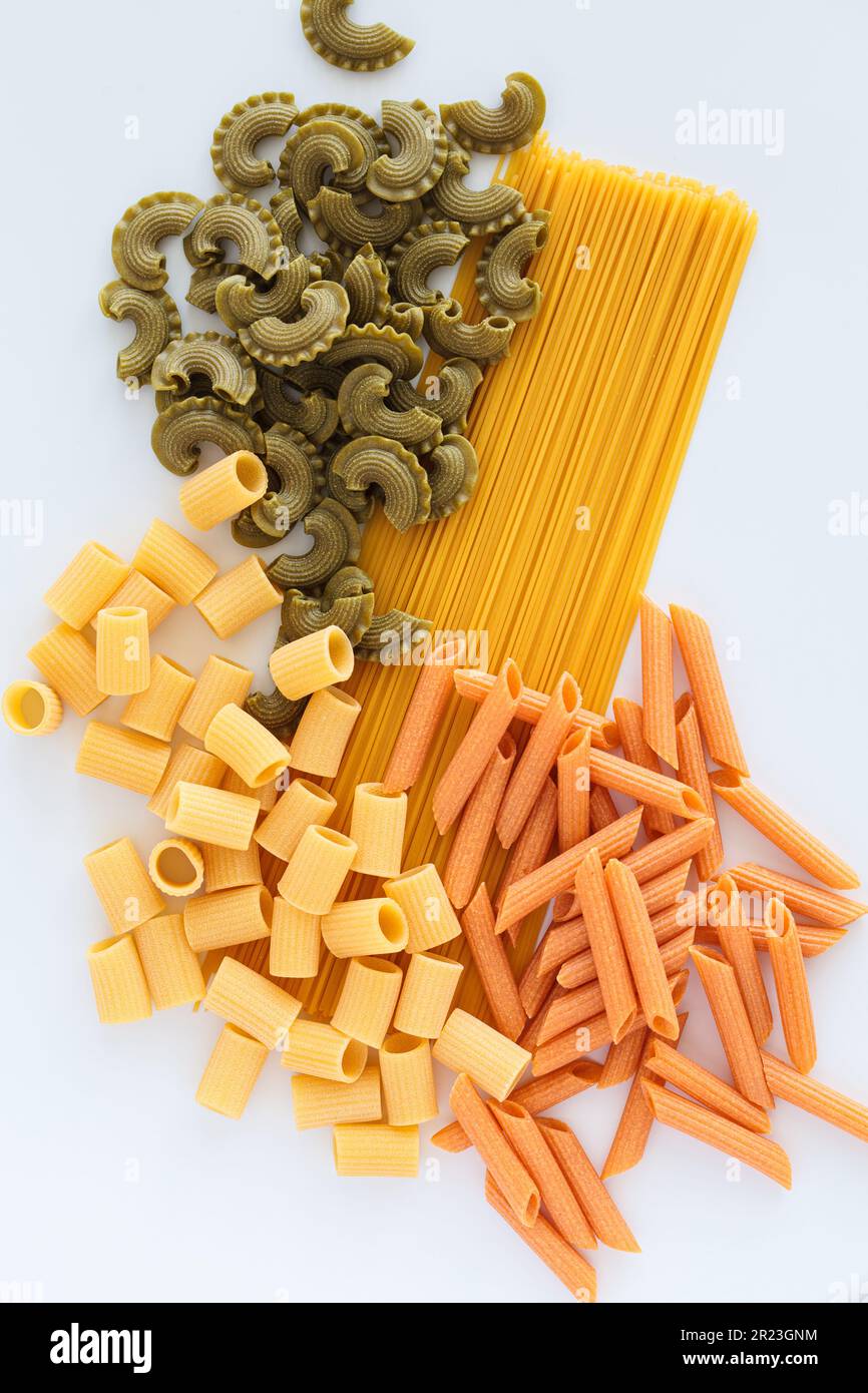 Different types of pasta on a white background Stock Photo - Alamy