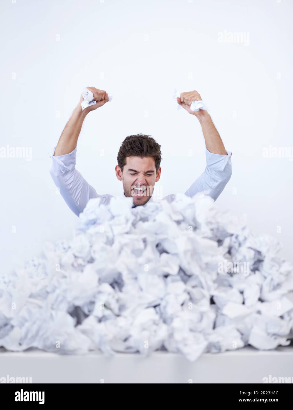 The paperwork keeps piling up around him. A young businessman buried in ...