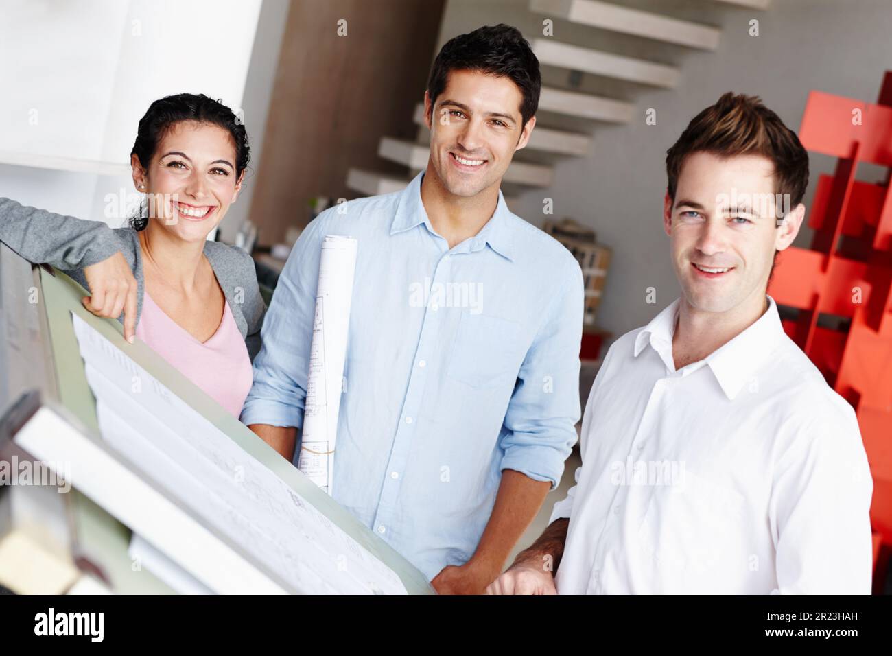 Team of successful architects. Portrait of three talented architects ...