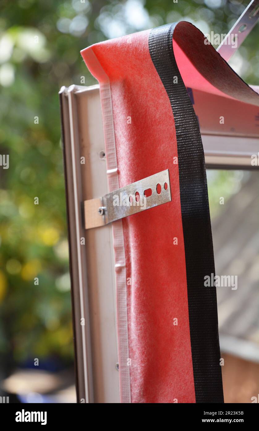 Close up on vapor barrier tape to cover window and door joints from inside. Window tape inside ...