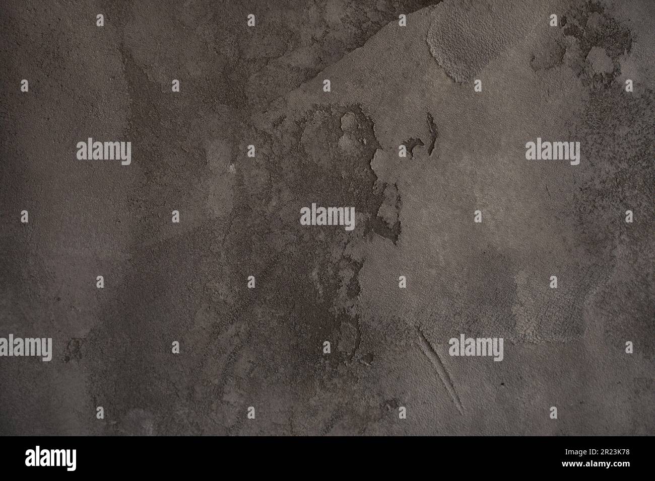 Stone surface with dark spots. The texture of old flagstone in the ...