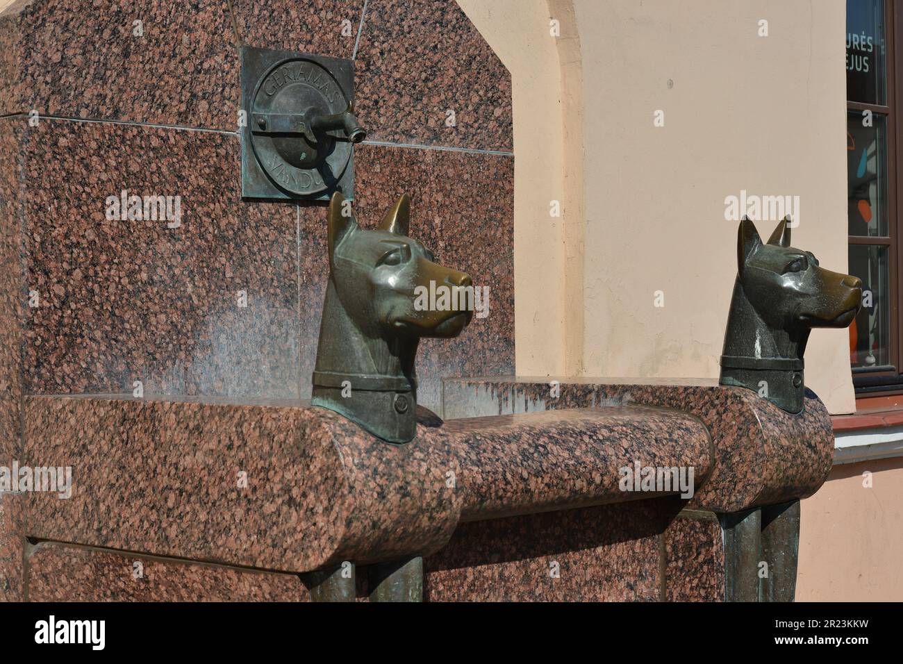 Metal dogs and water tap Stock Photo - Alamy