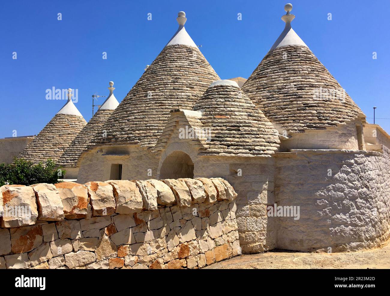 traditional house the trulli in stone and with a conical roof in ...