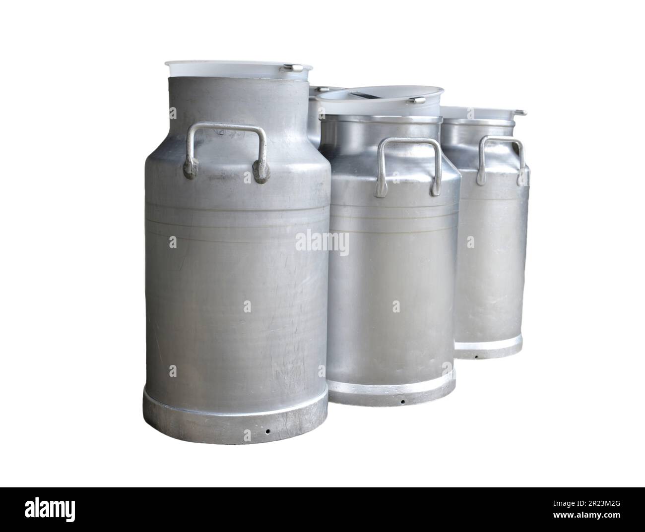 closeup on vintage metal milk cans isolated on white background ...