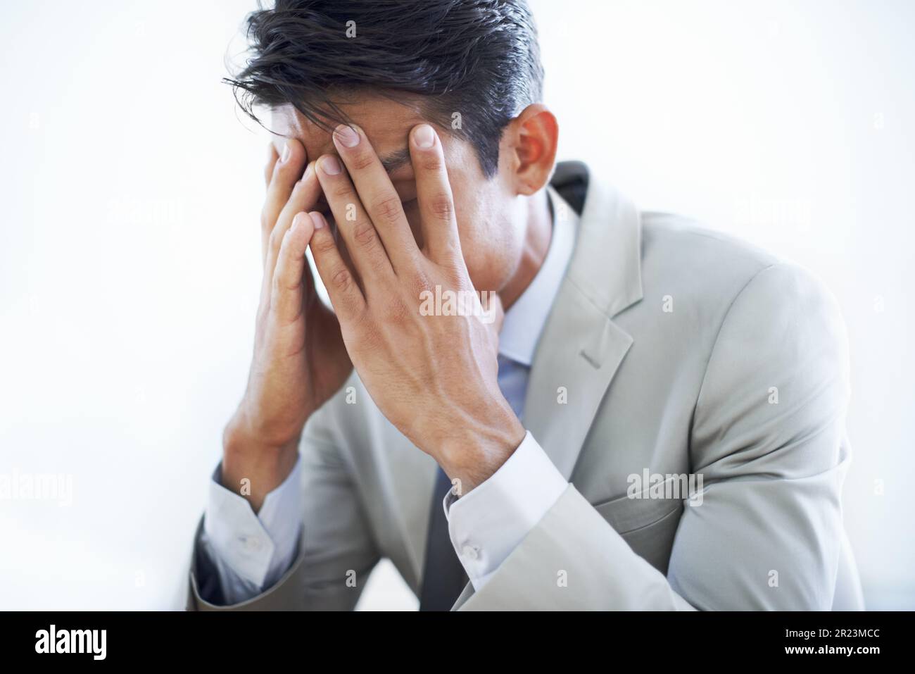 He made a dreadful deal. Closeup of a businessman sitting with his face ...