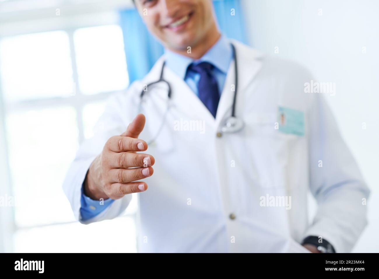 Man extending hand in help hi-res stock photography and images - Alamy