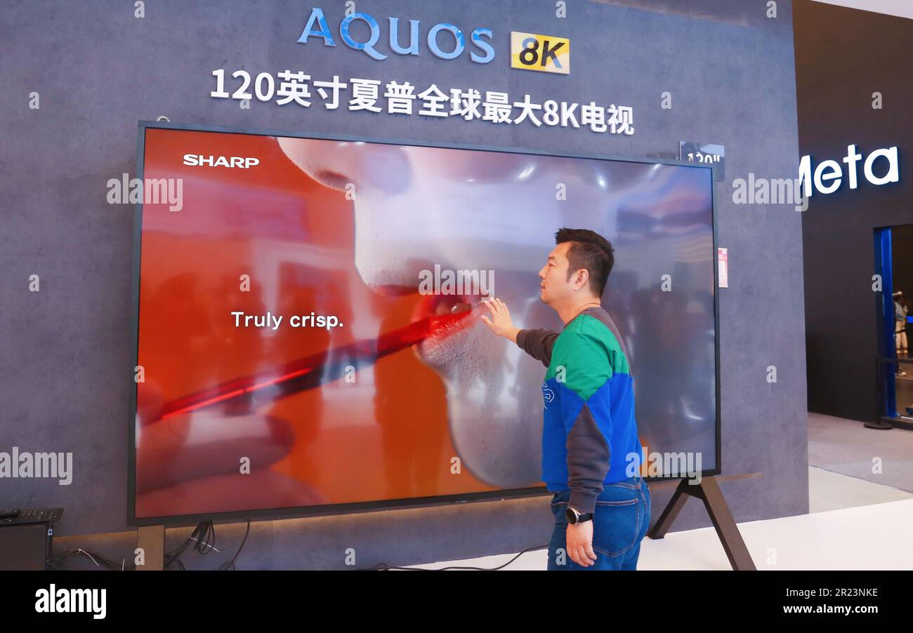 SHANGHAI, CHINA - APRIL 27, 2023 - Visitors look at the world's largest 8K television displayed ...