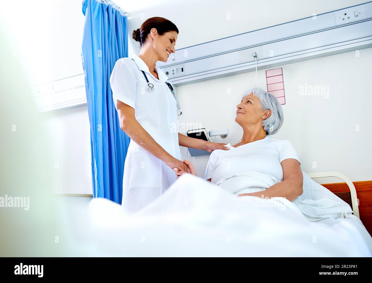 Putting her fears to rest. a beautiful young doctor comforting her ...