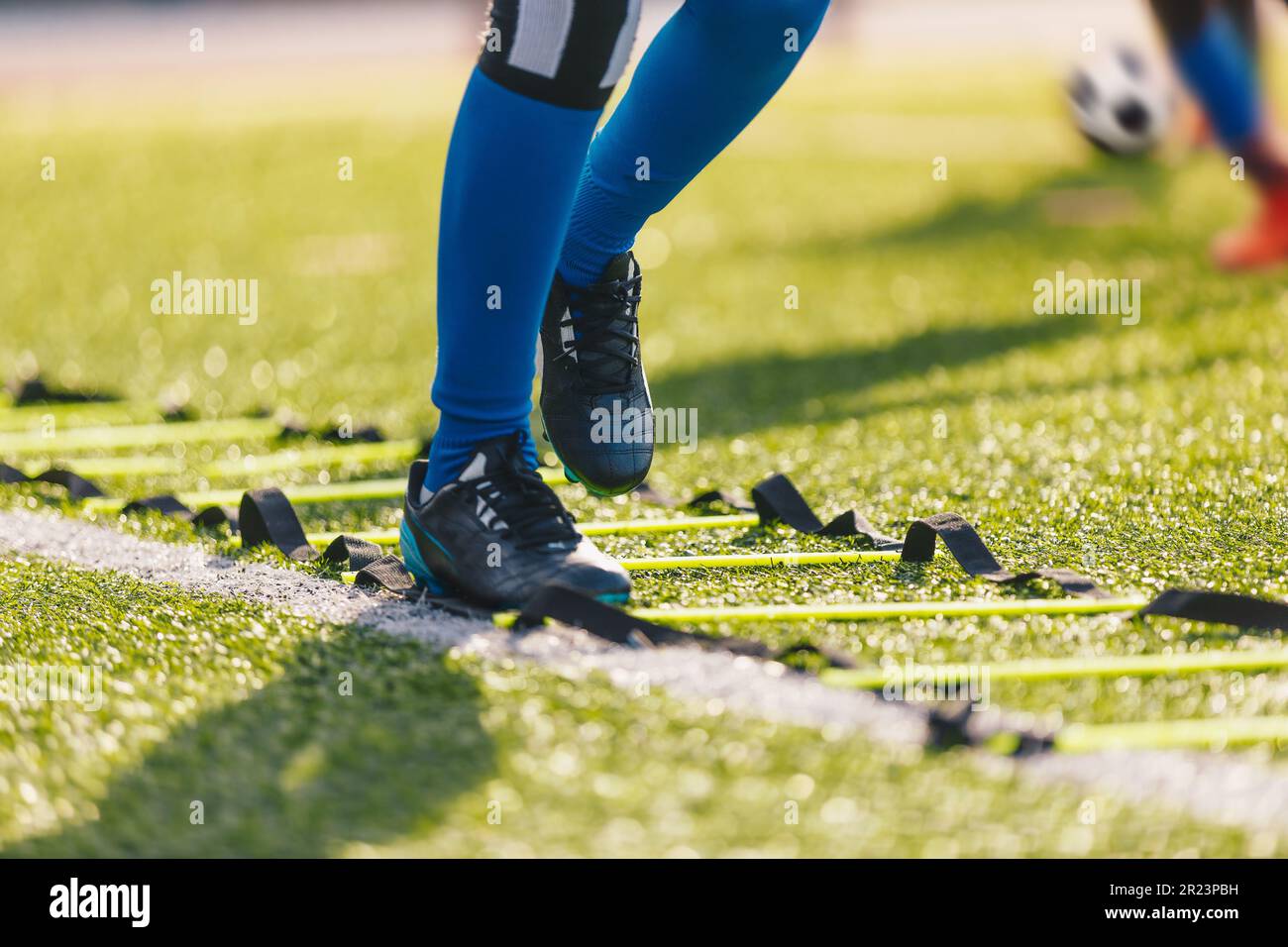 Young Soccer Player At Training Drill. Footballer Running Fast Through ...
