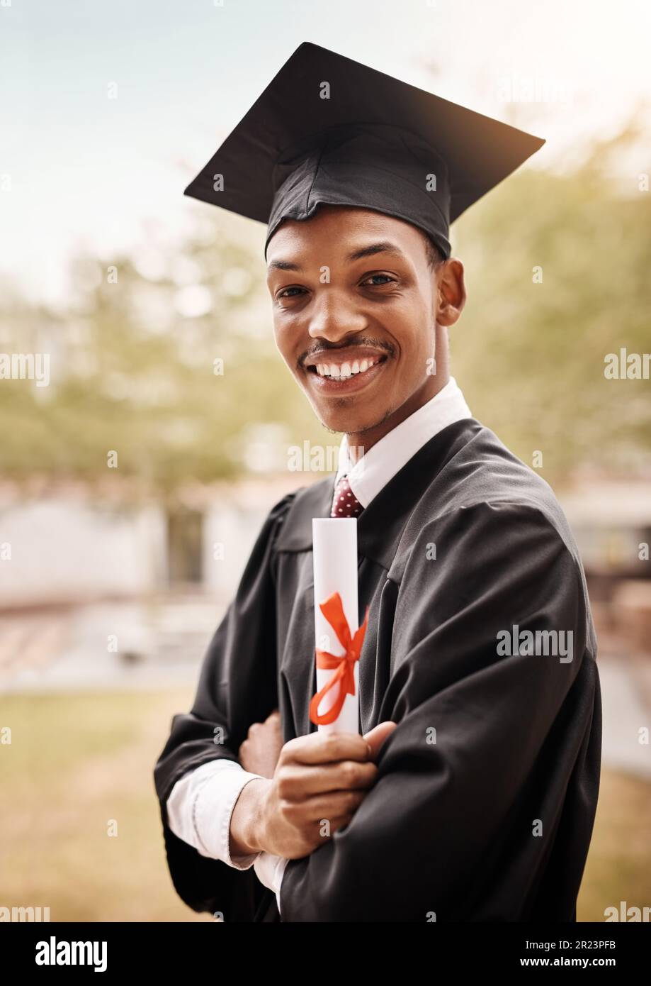 College student, portrait and black man at graduation with a diploma ...