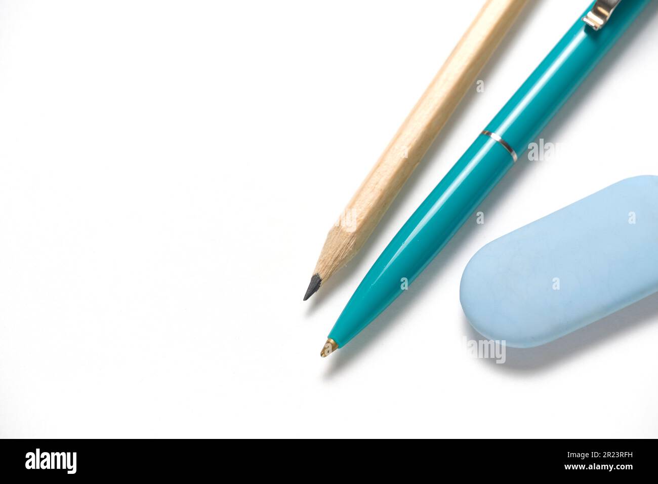 Simple pencil, ballpoint pen and eraser white background Stock Photo ...