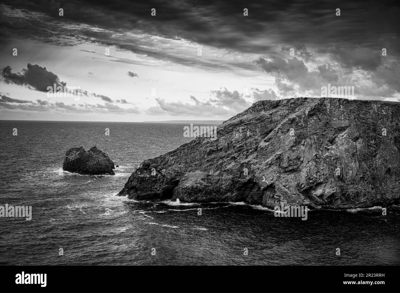 A rock structure jutting out into the sea Stock Photo - Alamy