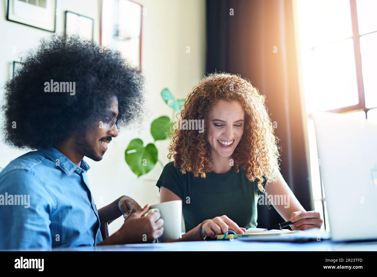 Partnering up to emerge with something great. two young designers brainstorming together in an ...