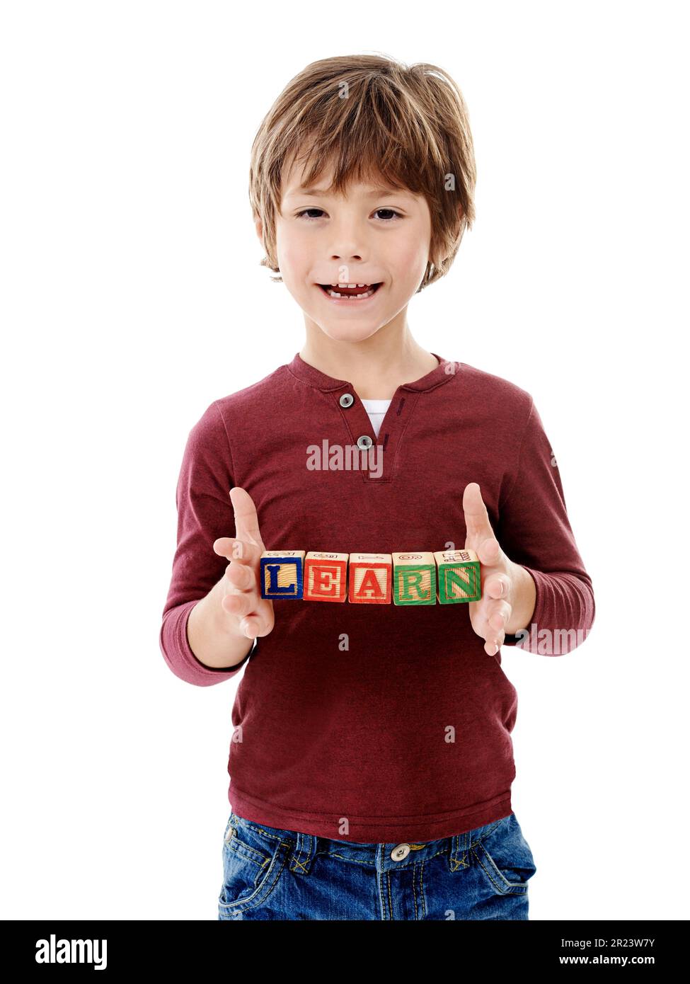 As you learn so you shall grow. Studio shot of a cute little boy ...