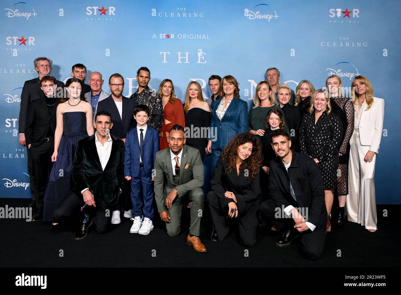 Cast and crew of the film pose for a photograph on the red carpet at ...